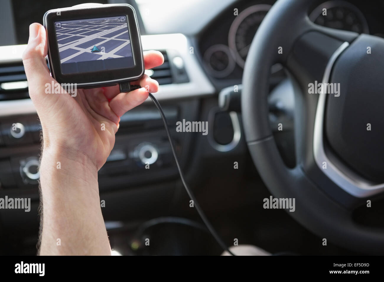 Man using satellite navigation system Stock Photo - Alamy