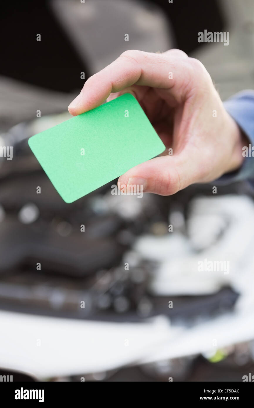 Close up of man holding card Stock Photo - Alamy