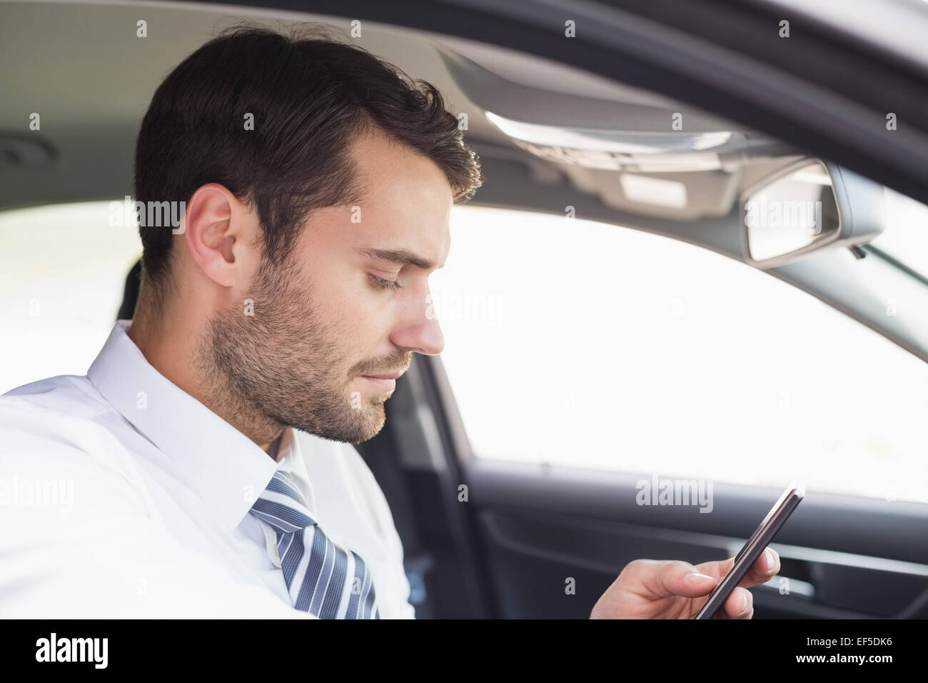 Businessman sending a text message Stock Photo - Alamy Businessman sending a text message Stock Photo - Alamy