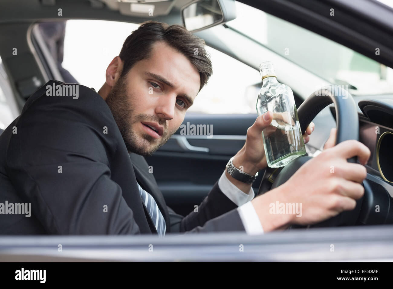 Young businessman driving while drunk Stock Photo - Alamy