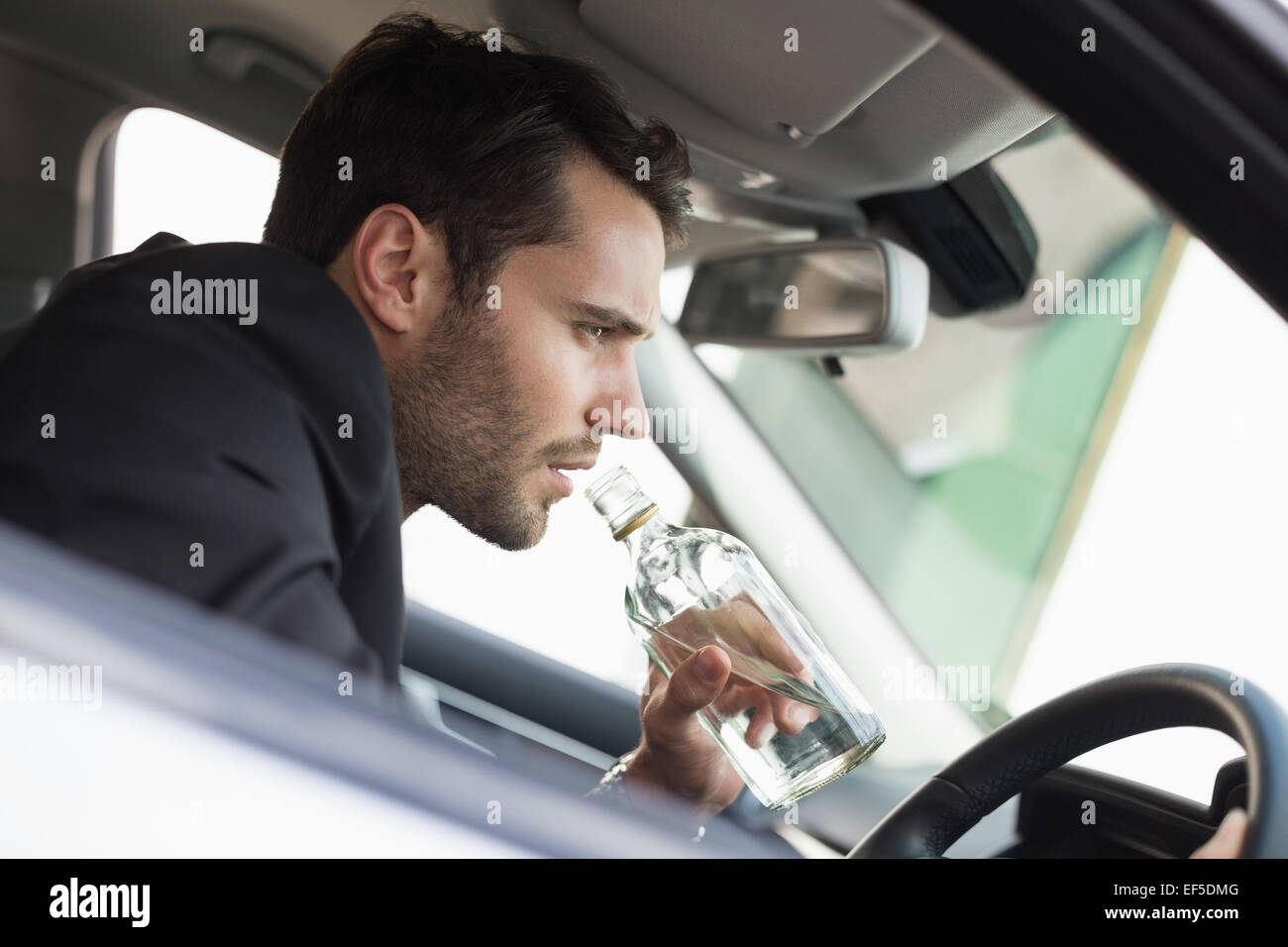 Young businessman driving while drunk Stock Photo - Alamy