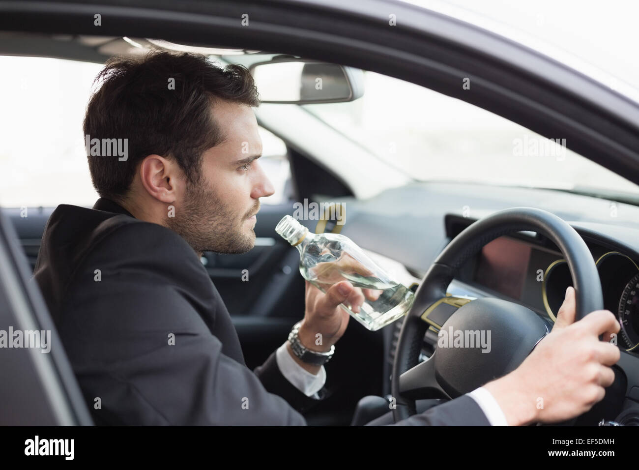 Young businessman driving while drunk Stock Photo - Alamy
