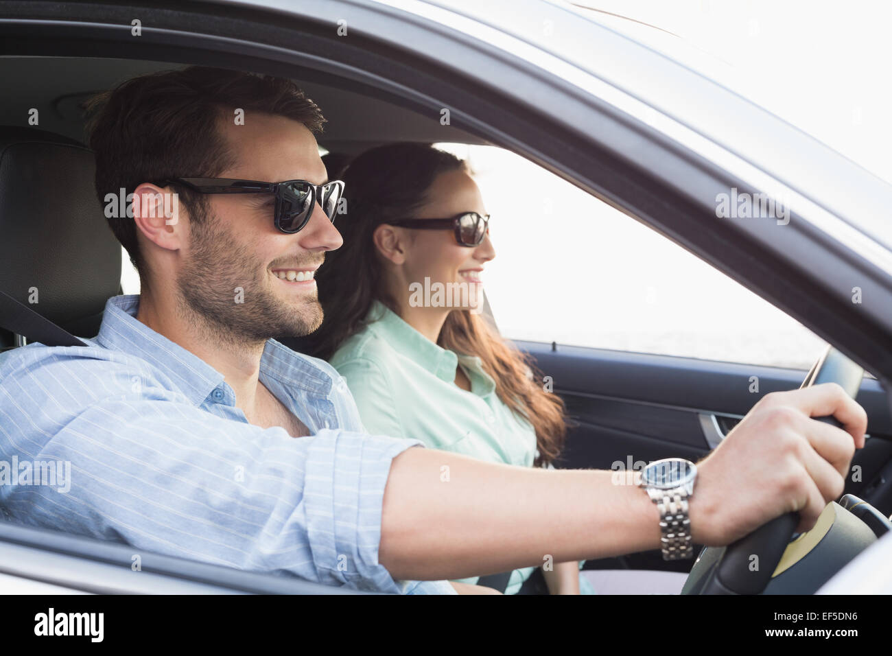 Young couple on a road trip Stock Photo - Alamy
