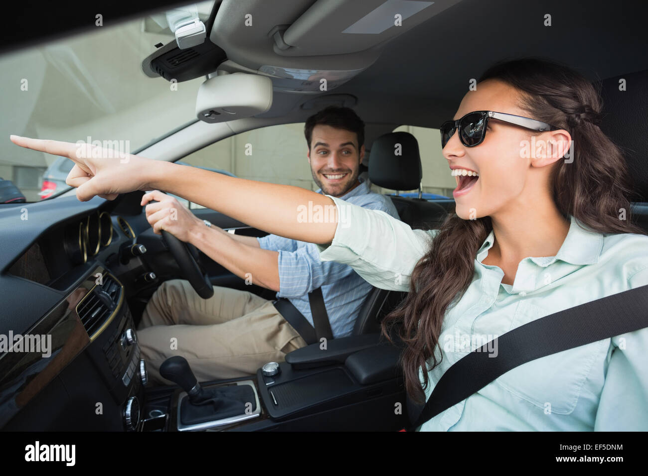 Young couple on a road trip Stock Photo - Alamy