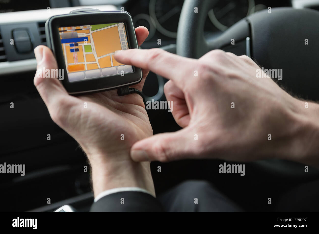 Man using satellite navigation system Stock Photo - Alamy