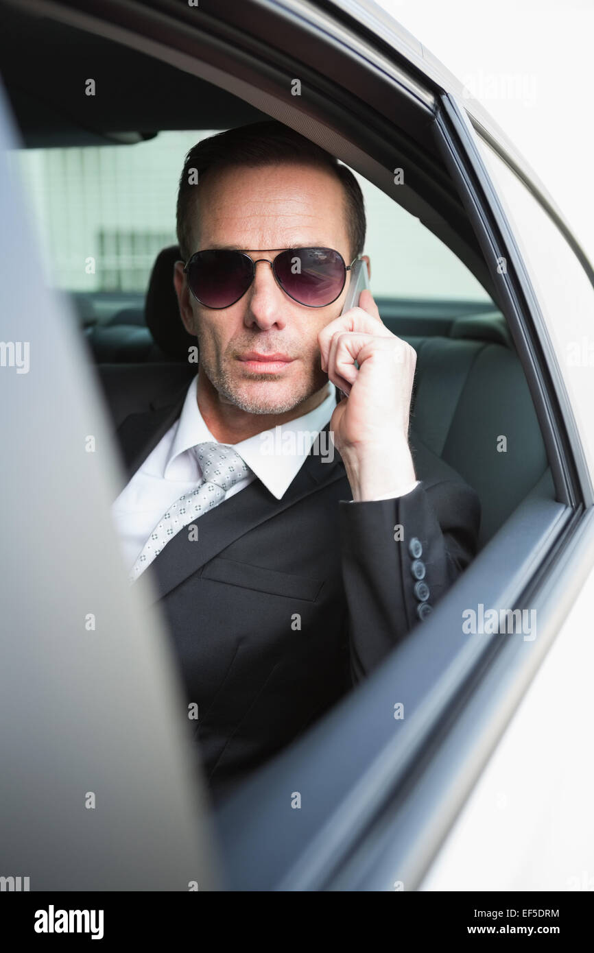 Businessman on the phone wearing sunglasses Stock Photo - Alamy
