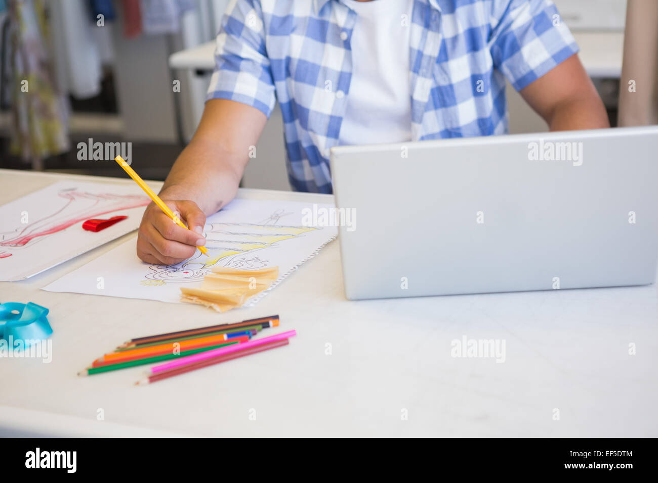 College student using laptop while drawing picture Stock Photo - Alamy