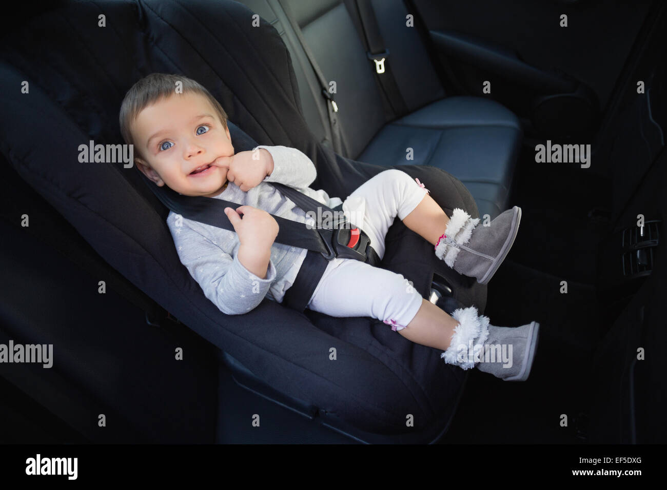 Cute baby in a car seat Stock Photo - Alamy