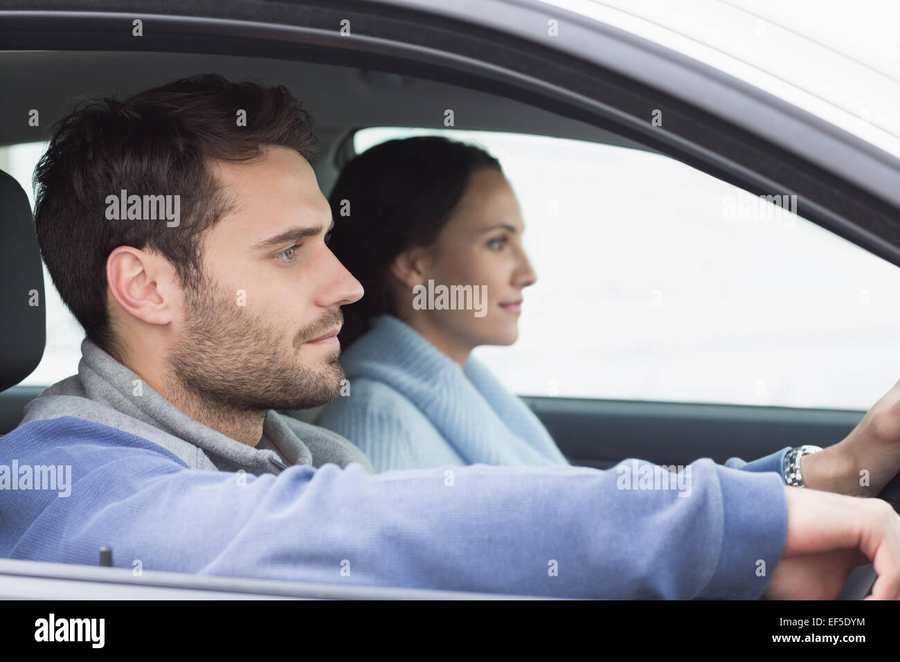 Young couple going for a drive Stock Photo - Alamy