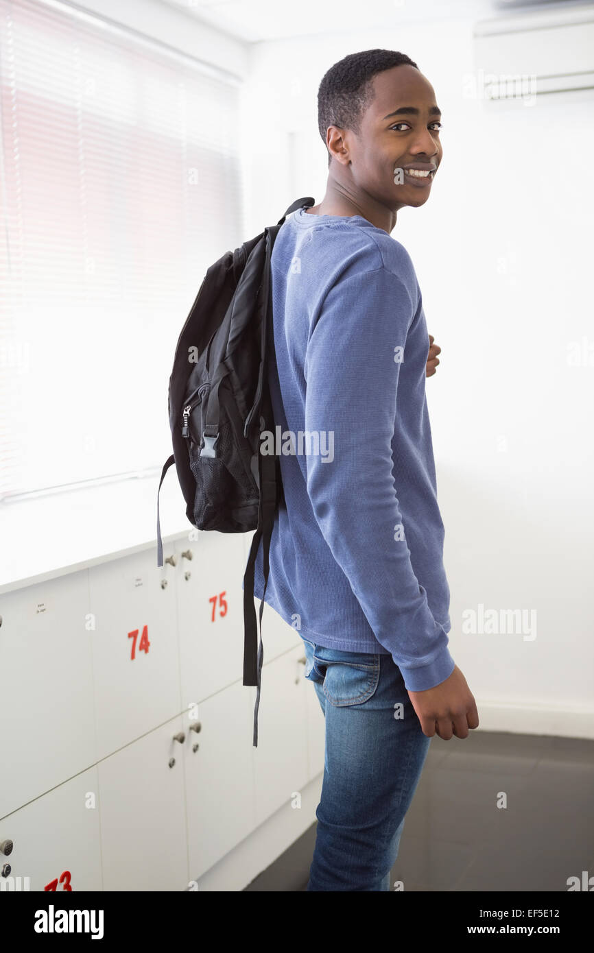 Smiling university student with backpack Stock Photo - Alamy