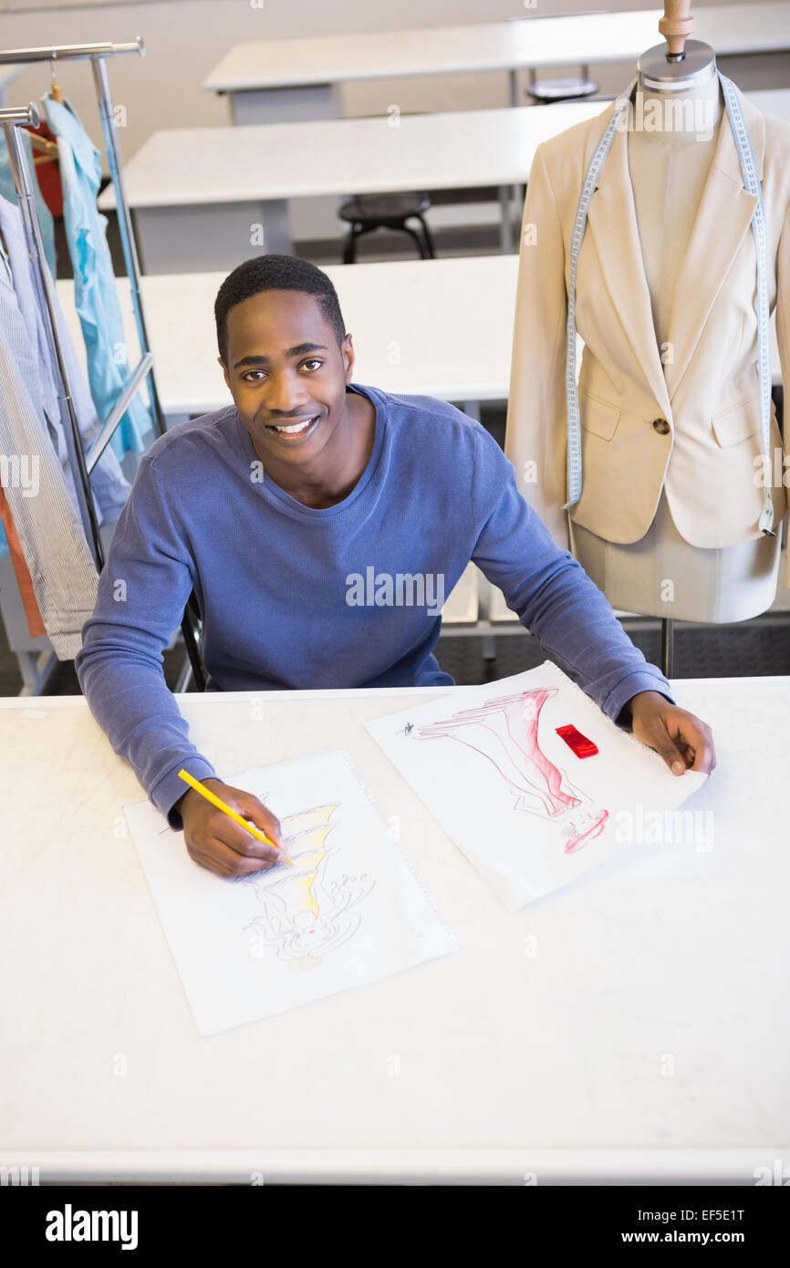 Smiling university student drawing picture Stock Photo - Alamy