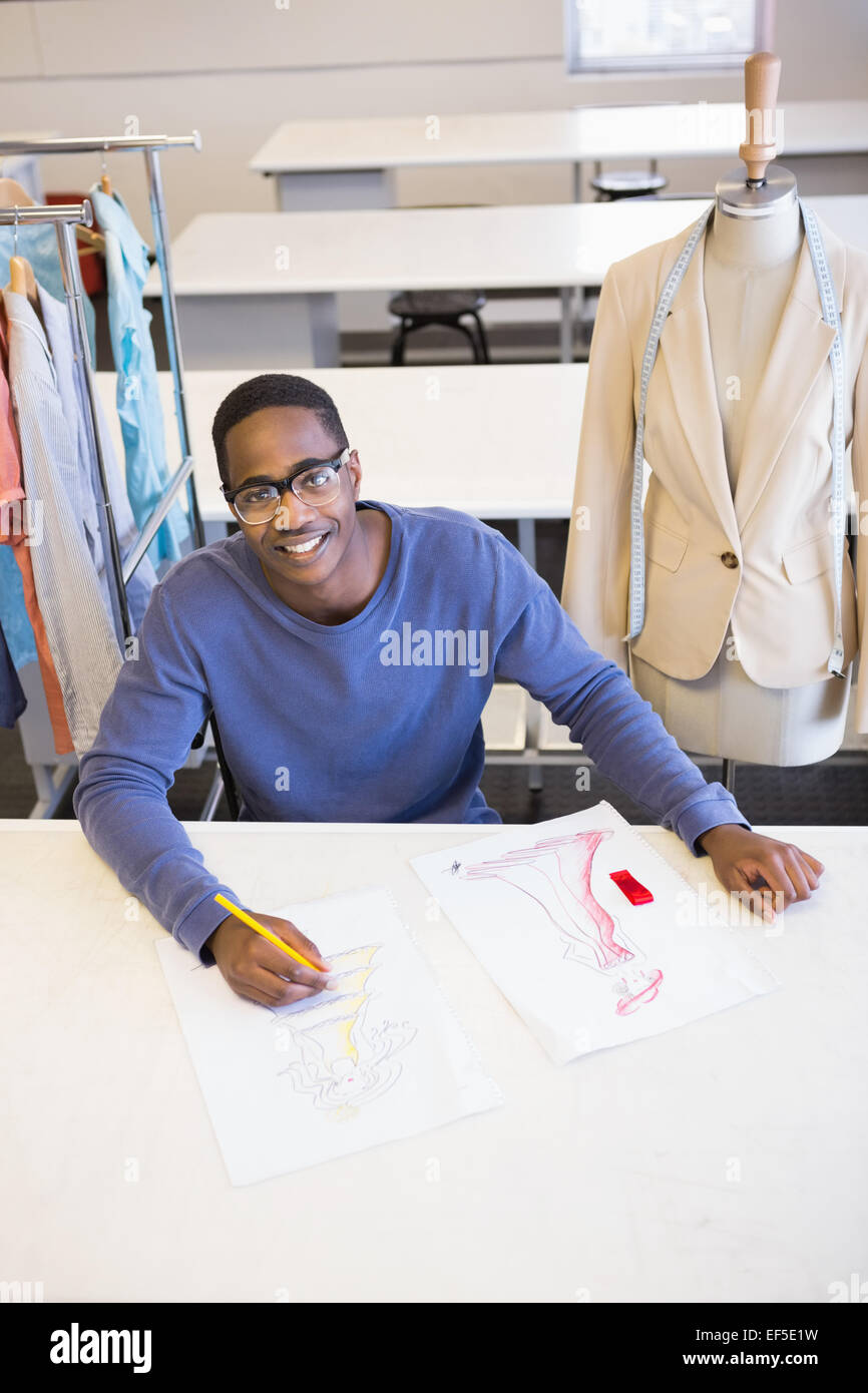 Smiling student drawing picture with colored pencil Stock Photo - Alamy