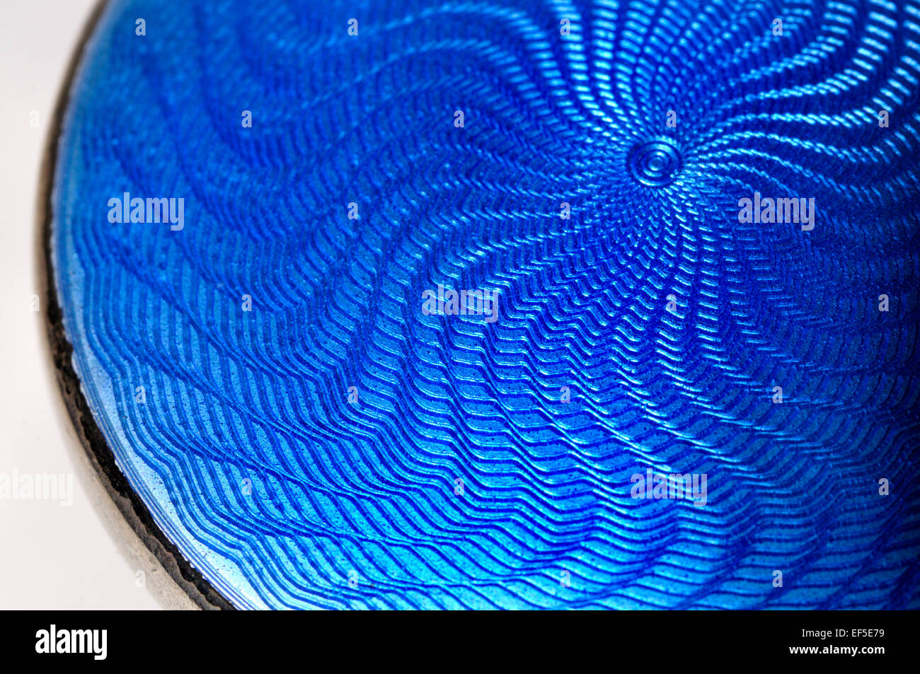 Guilloche work on the lid of a glass bottle - machine-tooled metal ...