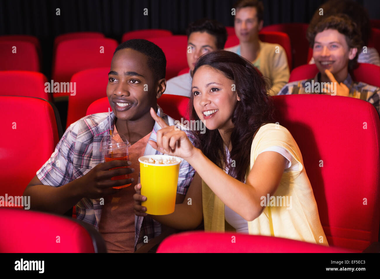 Young people watching a film Stock Photo - Alamy
