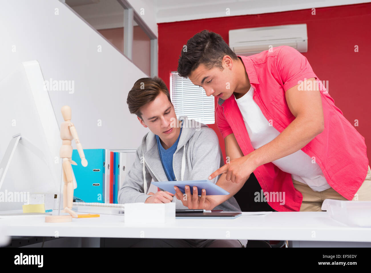 Students using computer and tablet together Stock Photo - Alamy
