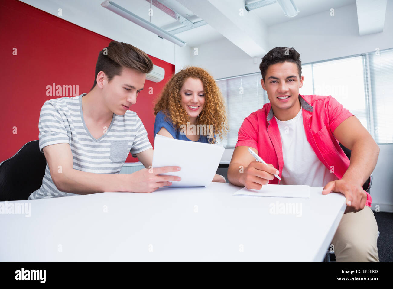 Students working together in class Stock Photo - Alamy
