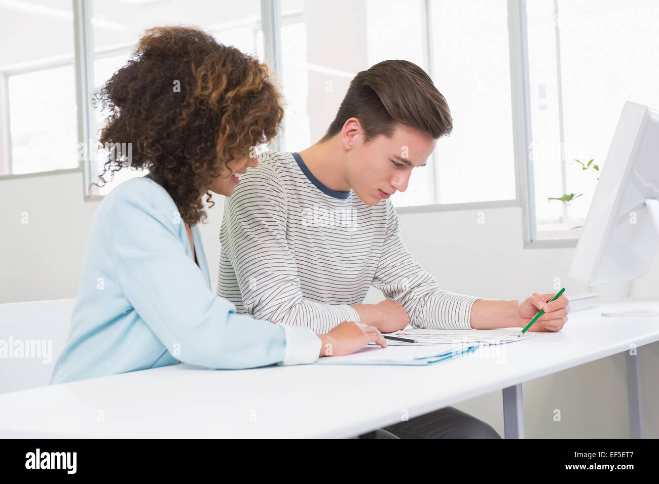 Students working together in class Stock Photo - Alamy