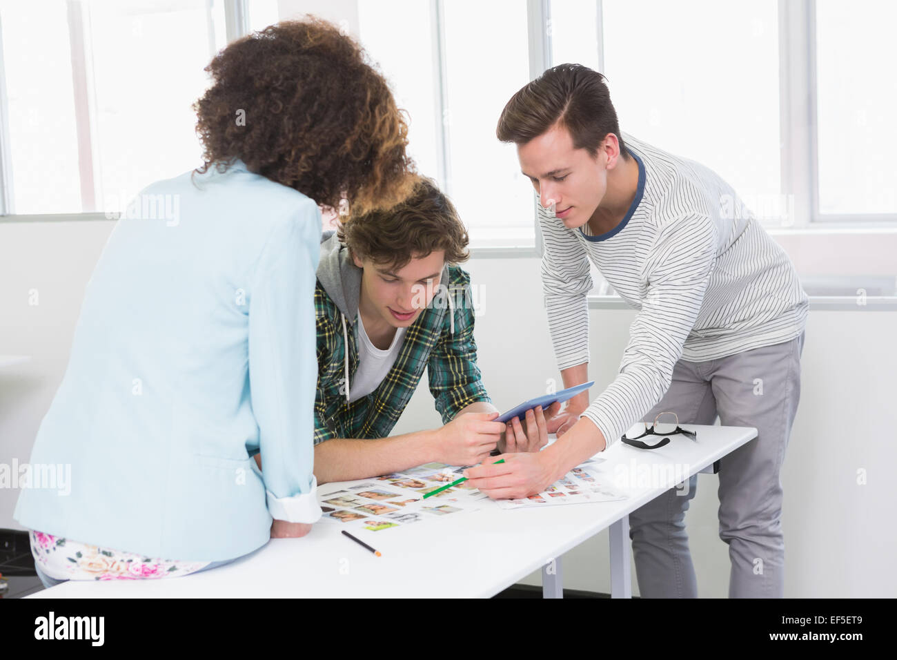 Students working with tablet pc and photos Stock Photo - Alamy