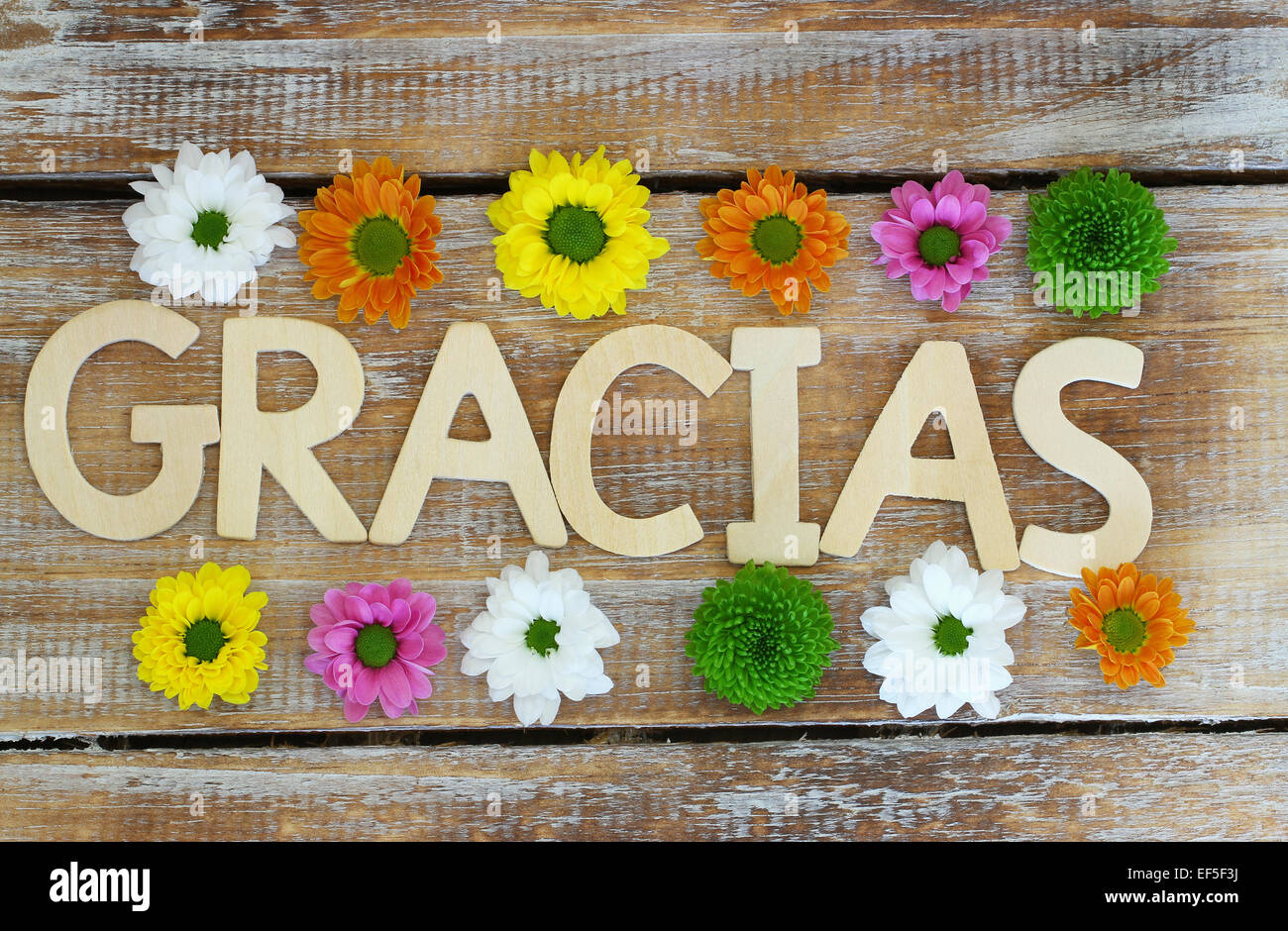 Gracias written with wooden letters on rustic surface and colorful ...