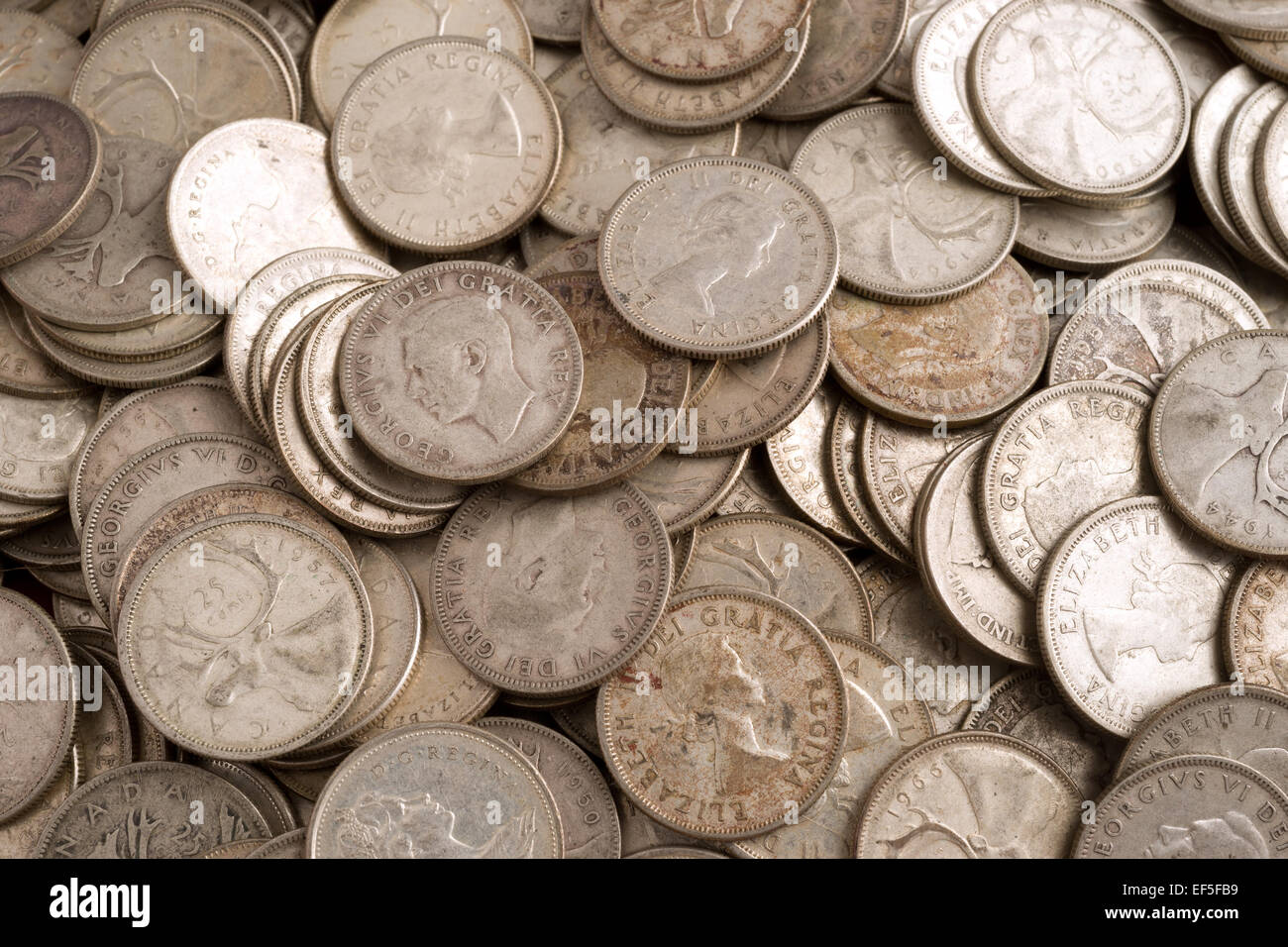 Old Canadian bullion silver quarters Stock Photo - Alamy
