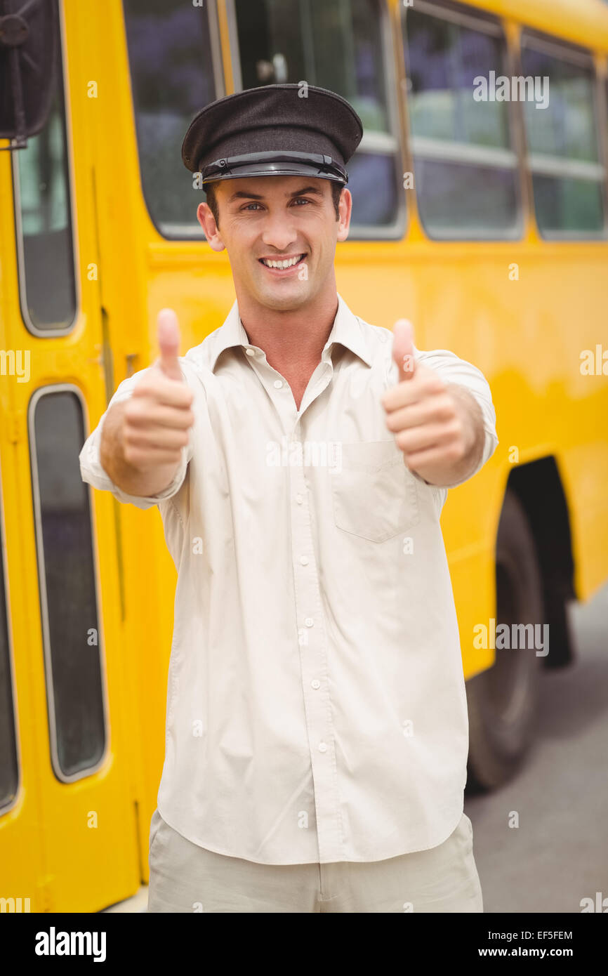 Smiling bus driver looking at camera Stock Photo - Alamy