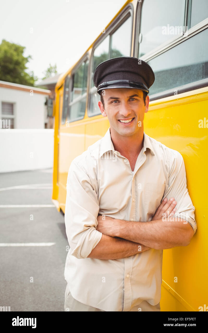 Smiling bus driver looking at camera Stock Photo - Alamy