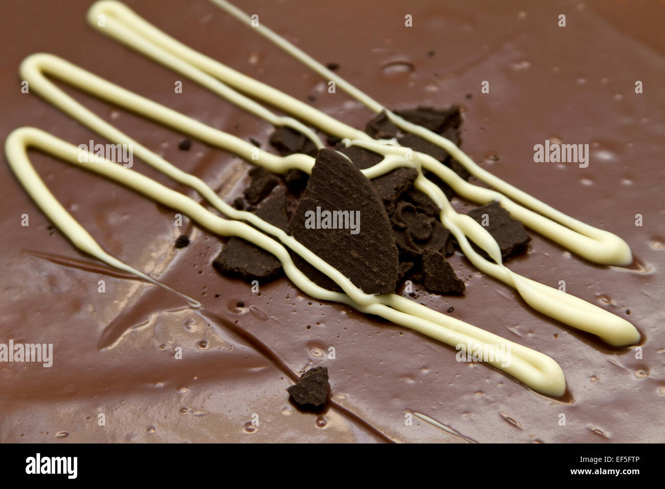 Chocolate cake's decoration with white chocolate and biscuits Stock ...