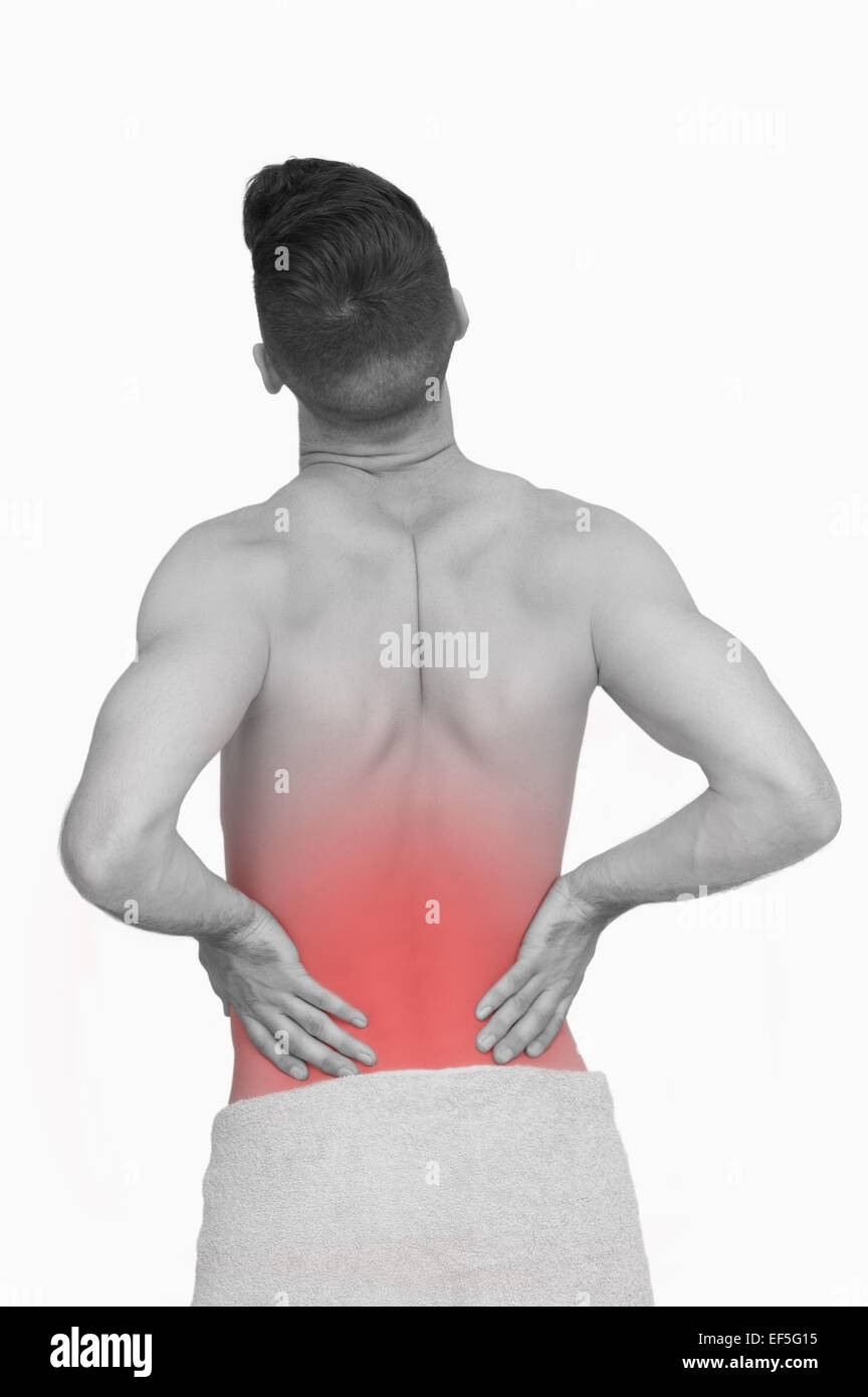 Rear view of shirtless man with back pain Stock Photo - Alamy