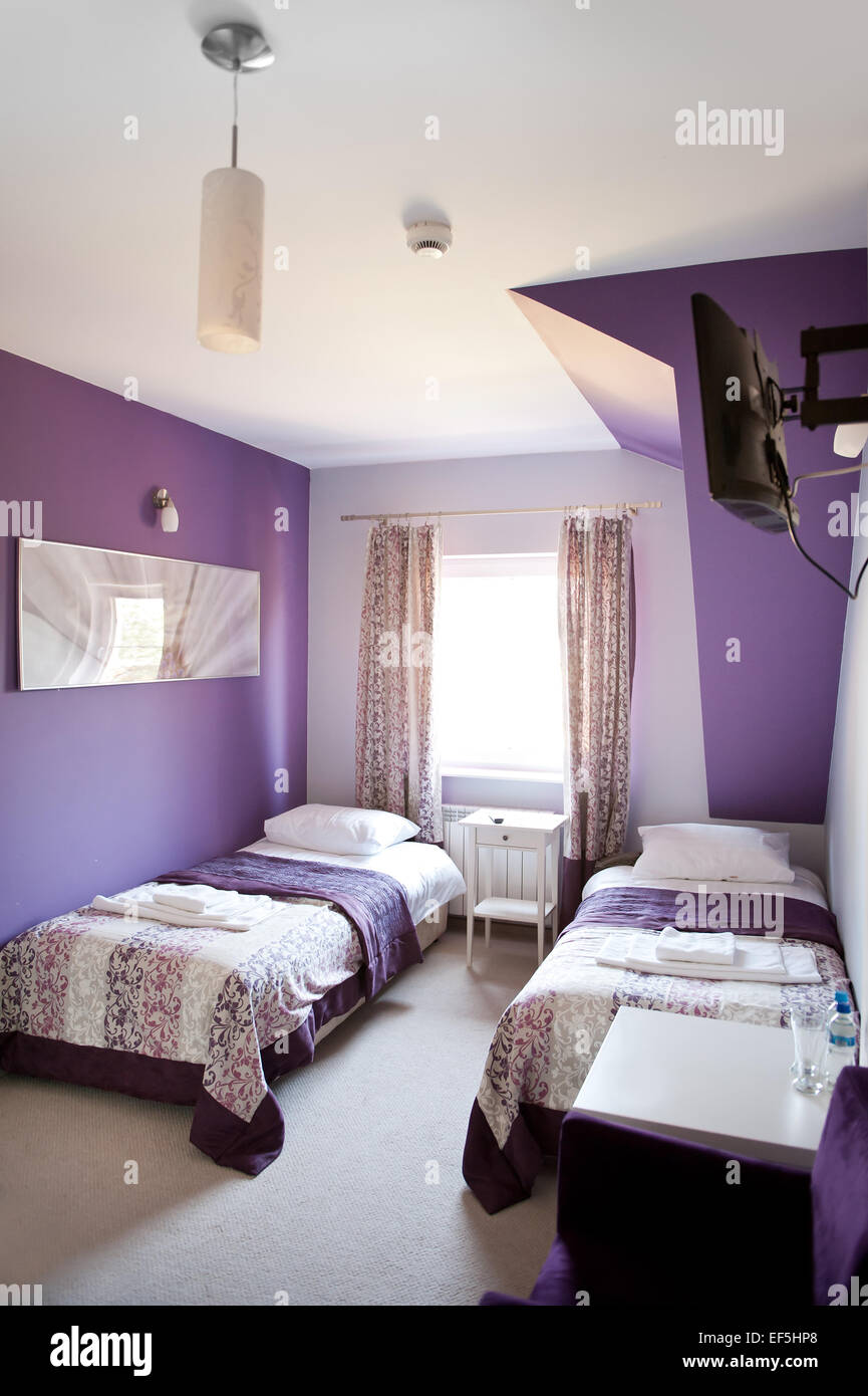 Hotel room purple accommodation interior Stock Photo - Alamy