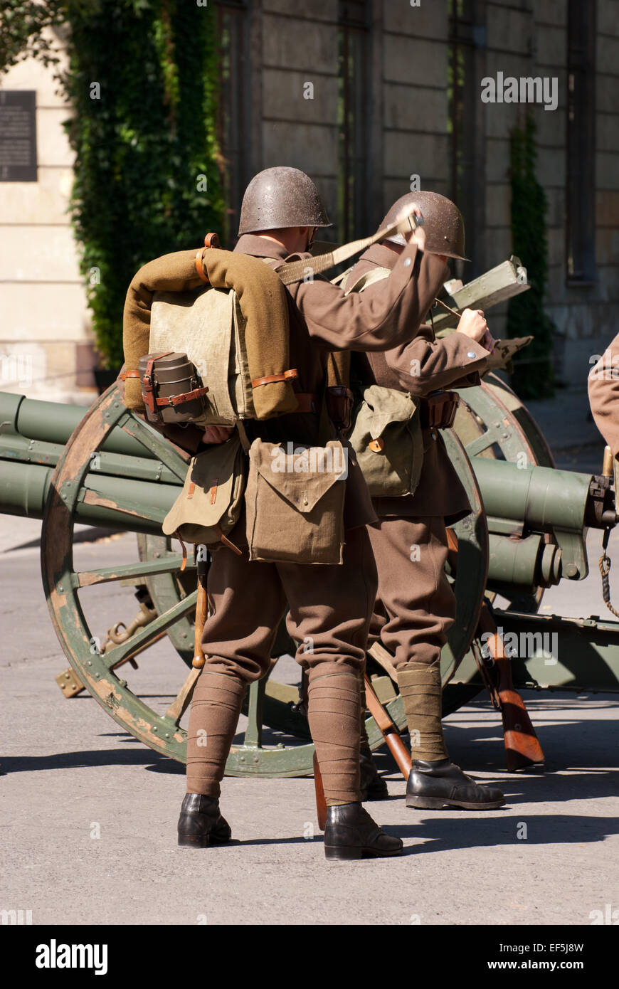 Soldiers wearing uniform backpacks war cloth Stock Photo - Alamy