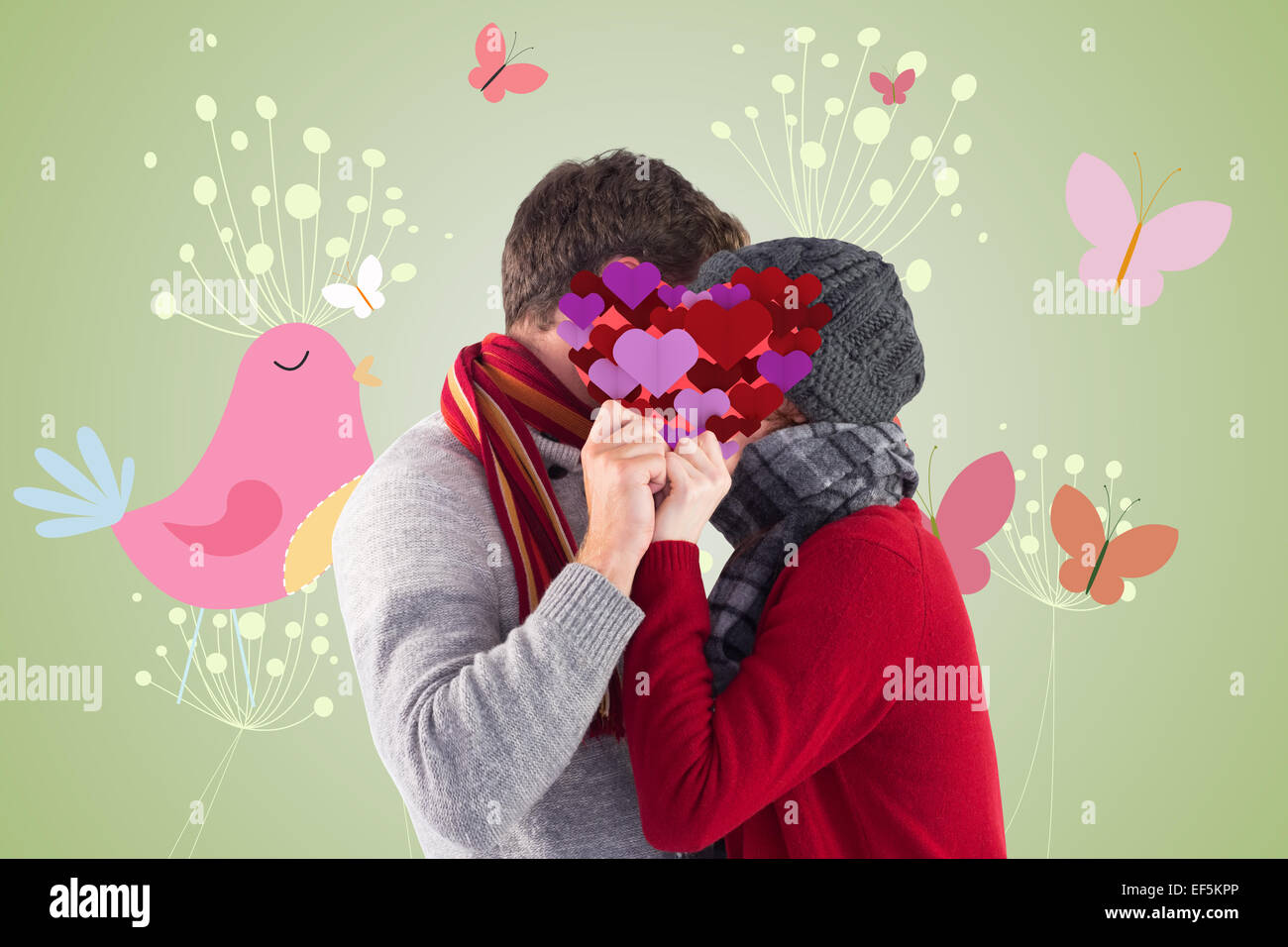 Composite image of couple holding a red heart Stock Photo - Alamy