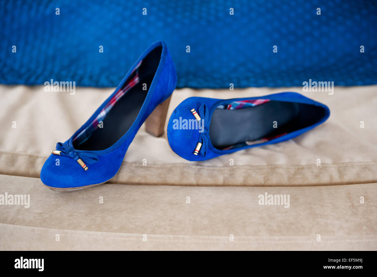 Female bridal two blue shoes Stock Photo - Alamy