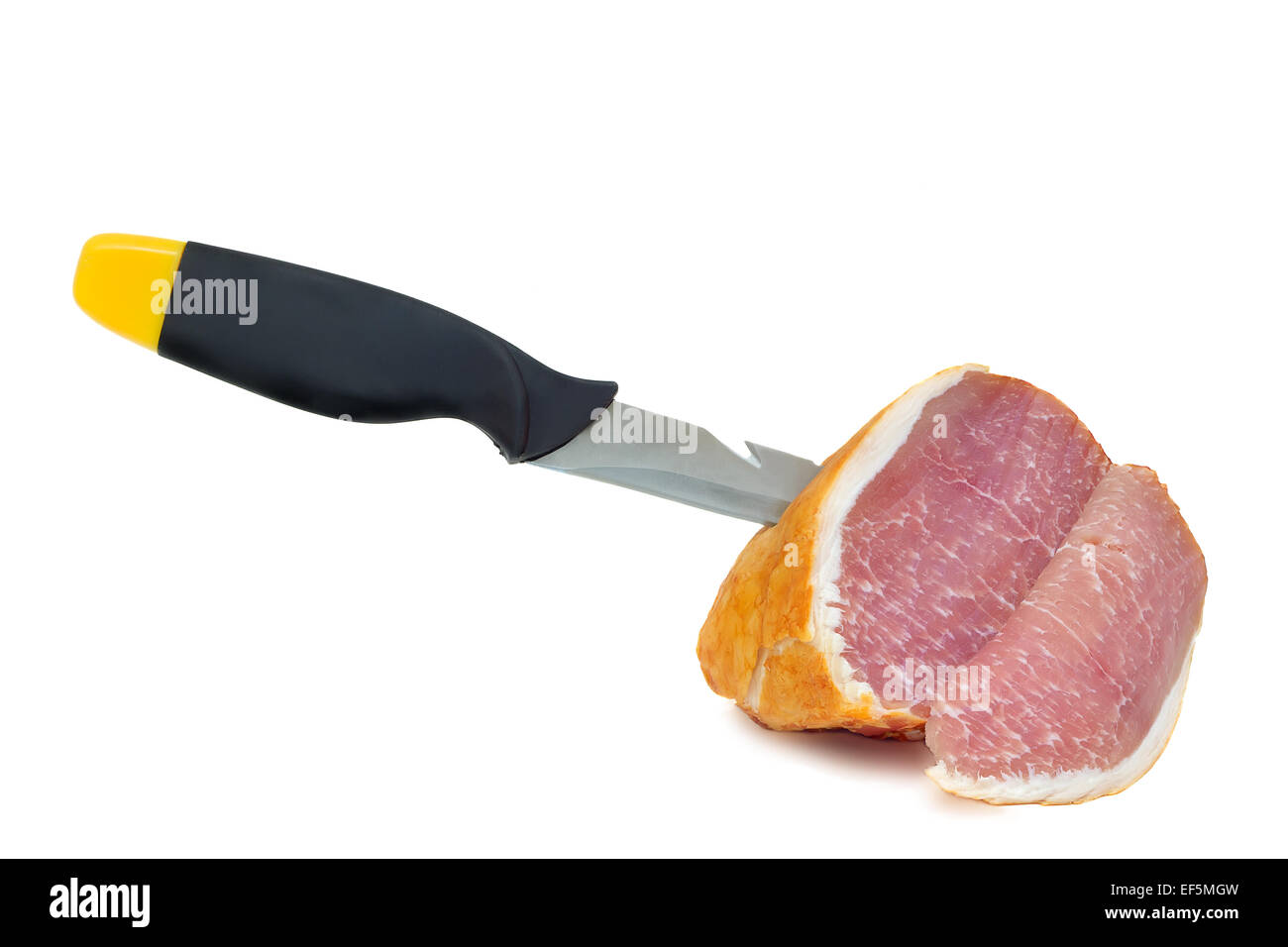 Tasty piece of ham on a knife edge . Presented on a white background ...