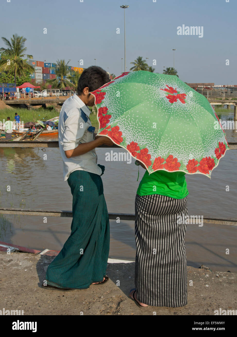 Couple in the harbour in Yangon, Myanmar Stock Photo - Alamy