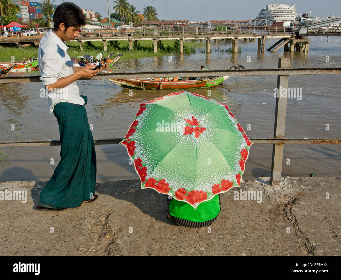 Couple in the harbour in Yangon, Myanmar Stock Photo - Alamy