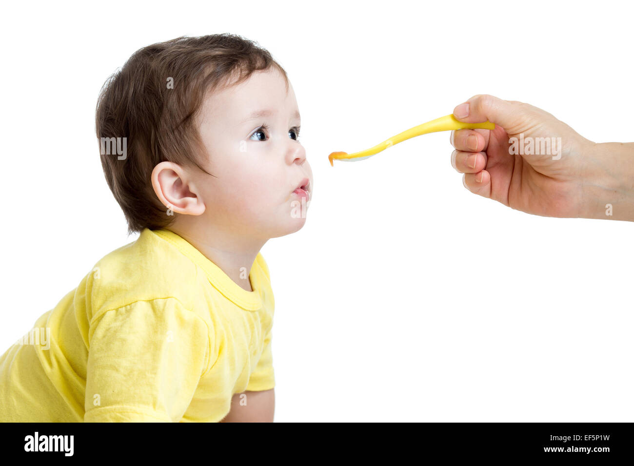 baby eating food isolated on white Stock Photo - Alamy