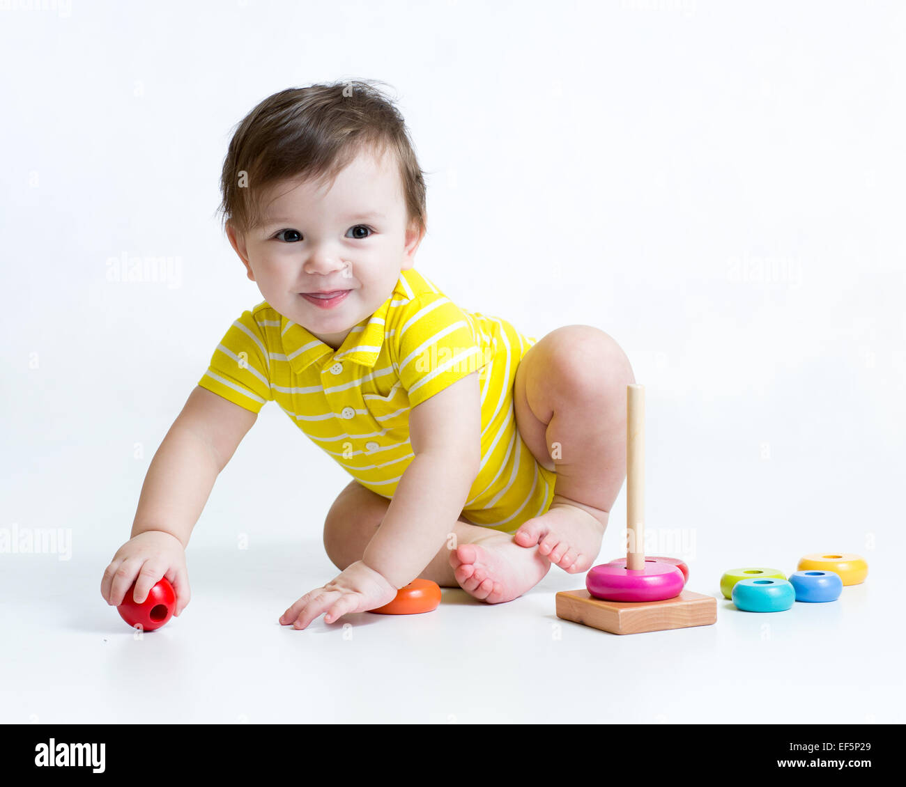 baby boy playing with pyramid toy Stock Photo - Alamy
