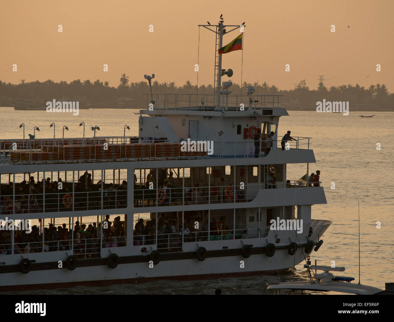 Passenger ferry at sunset in the harbour in Yangon, Myanmar Stock Photo - Alamy