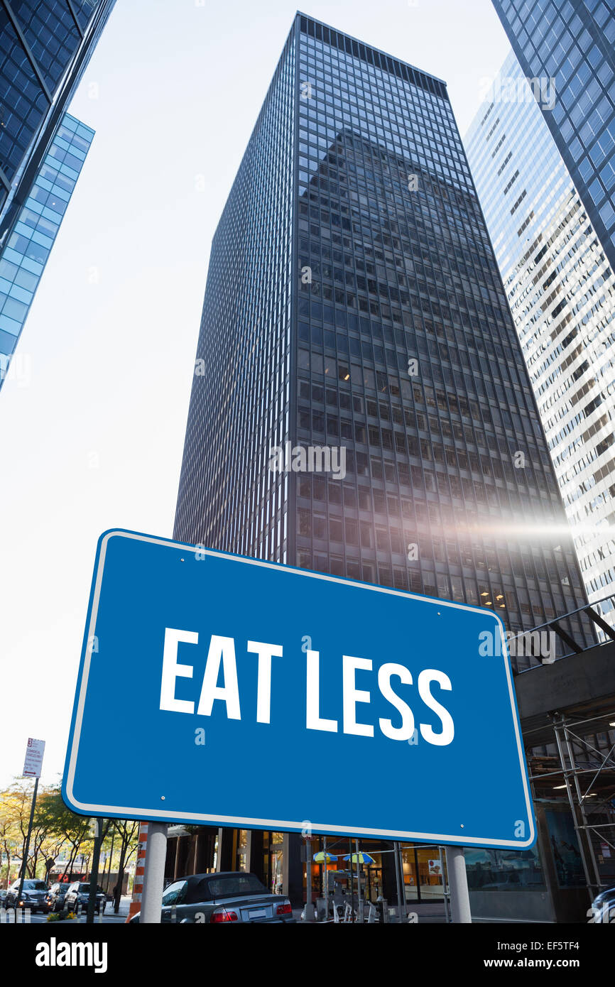 Eat less against skyscraper in city Stock Photo - Alamy