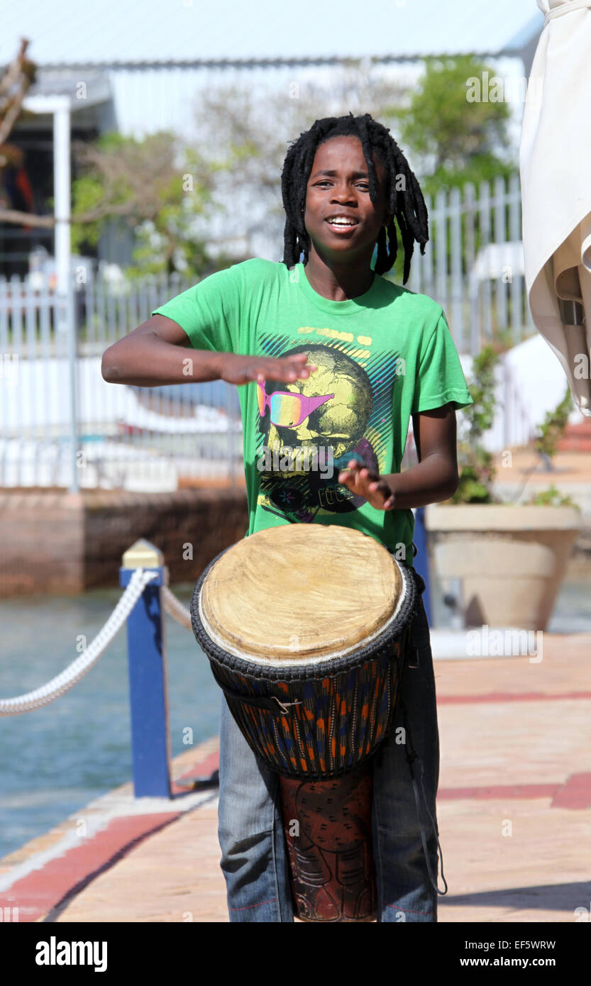 Young street performer outside a cafe at Simons Town in South Africa ...