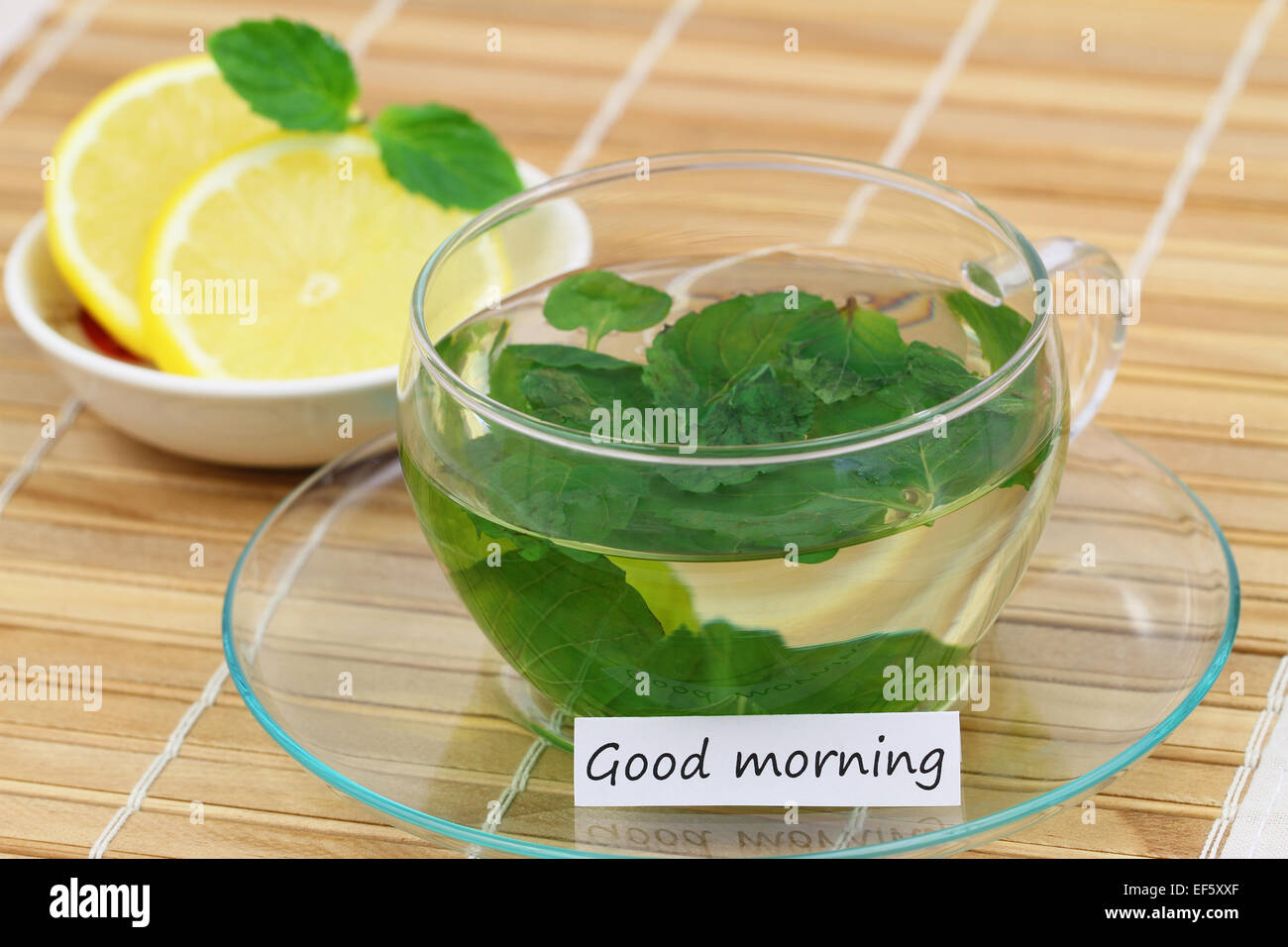 Good morning card with cup of mint tea and lemon Stock Photo - Alamy