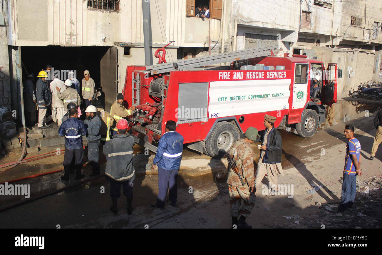 Fire brigade extinguishing fire erupted in a factory located in New ...