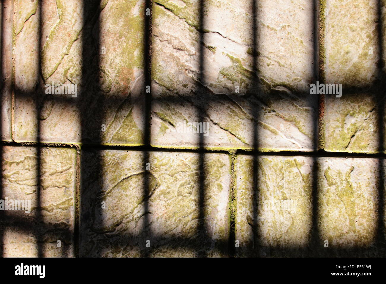 Stone slabs with lines of rectangular shadows Stock Photo - Alamy