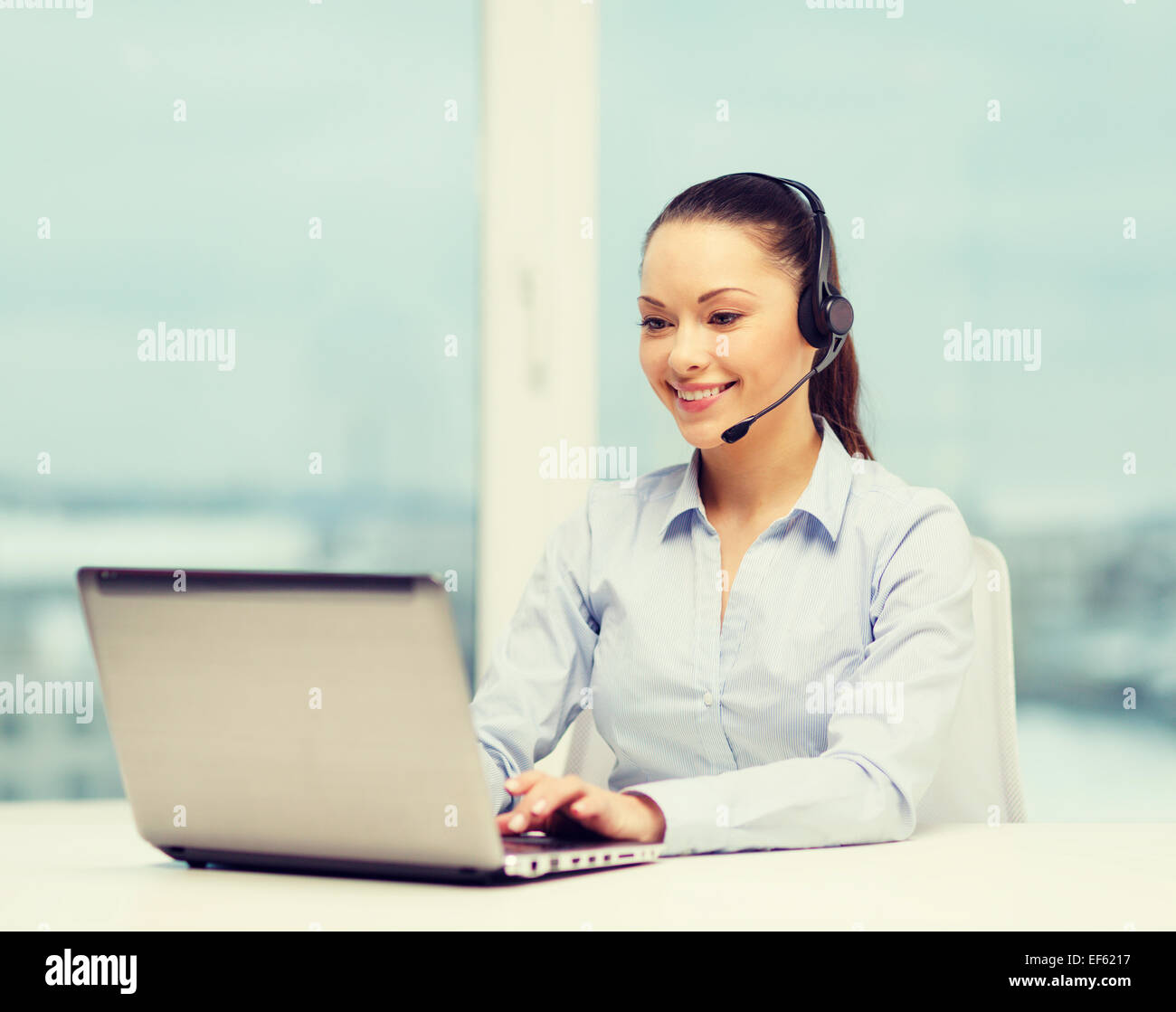 friendly female helpline operator Stock Photo - Alamy