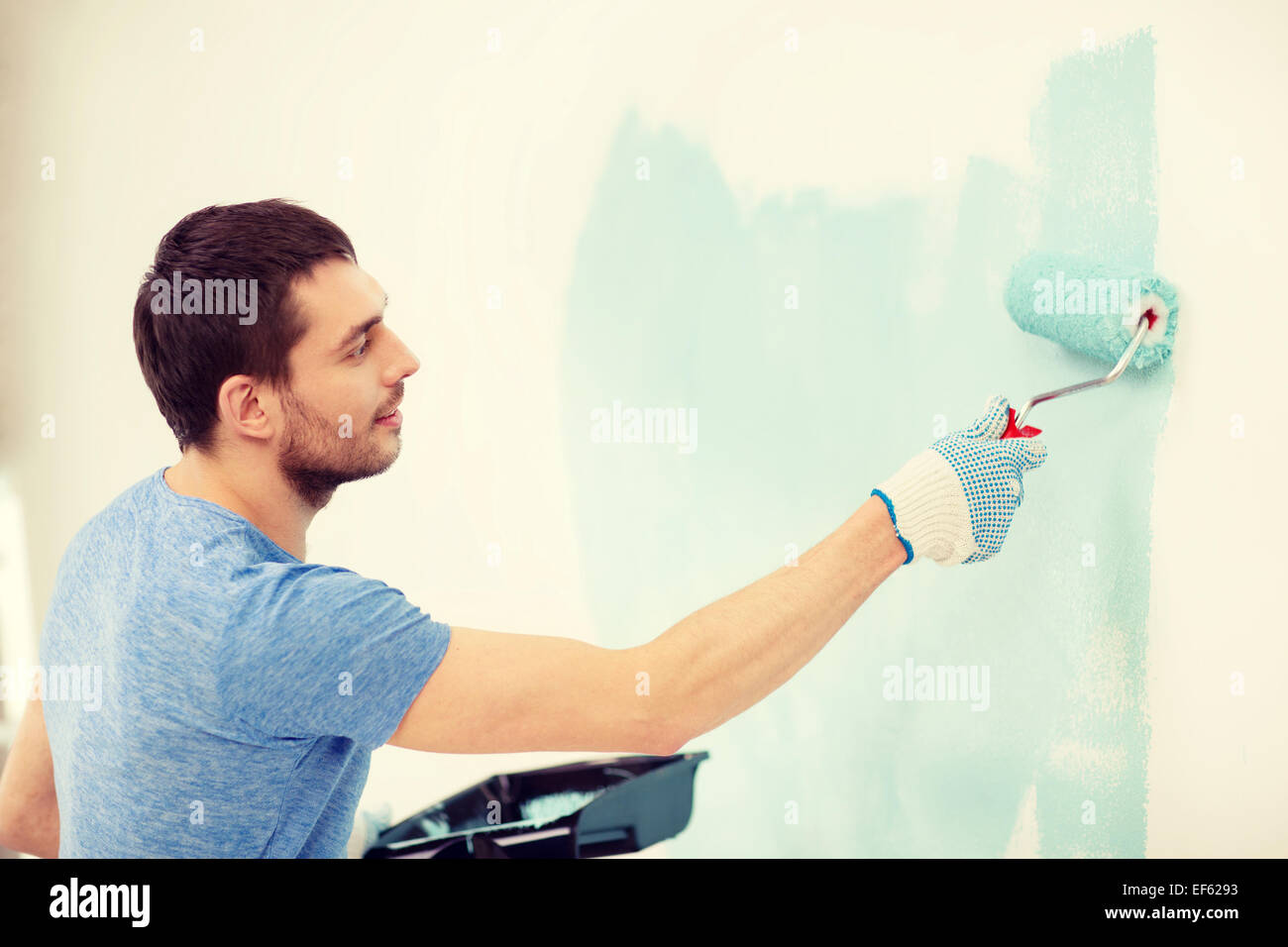 Happy worker painting wall hi-res stock photography and images - Alamy