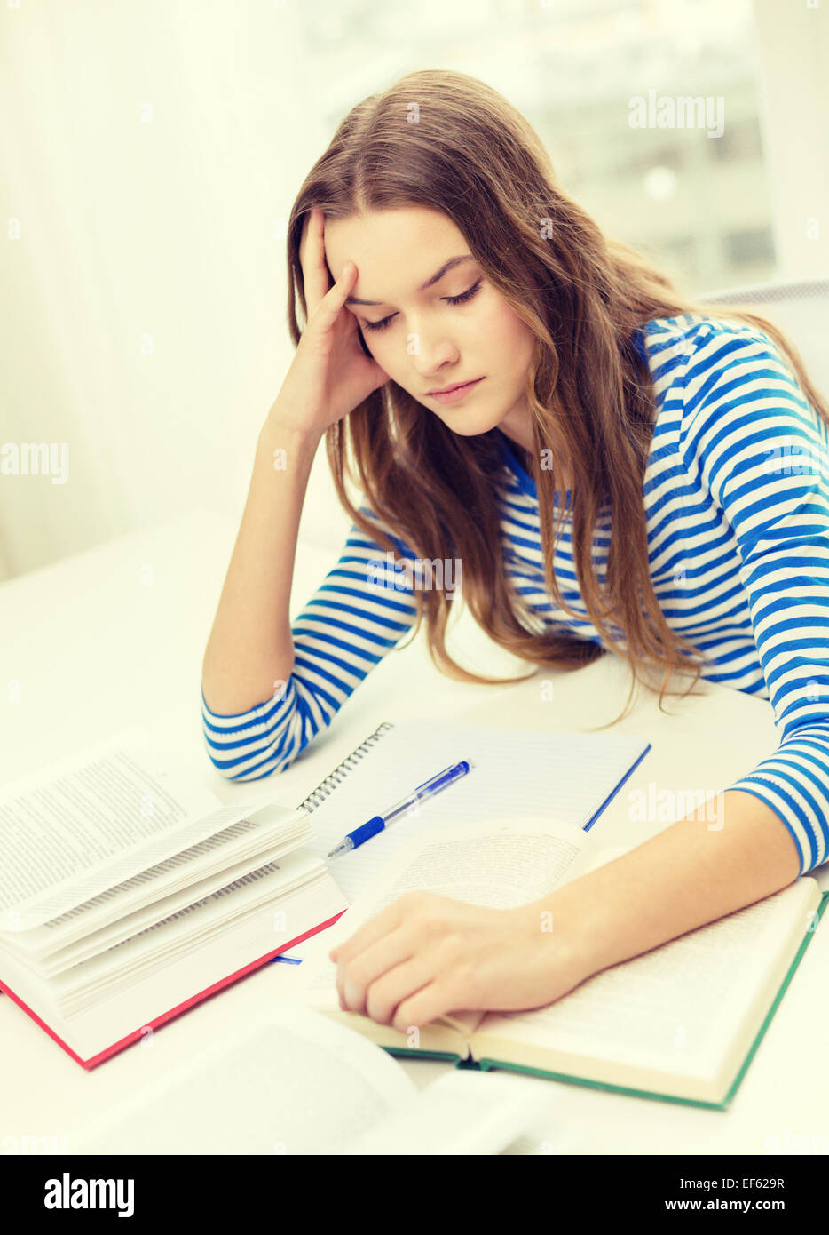 stressed student girl with books Stock Photo - Alamy