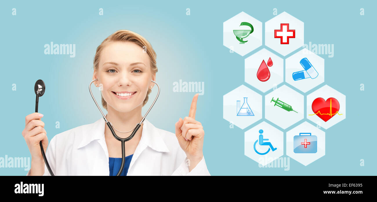 smiling doctor over medical icons blue background Stock Photo - Alamy