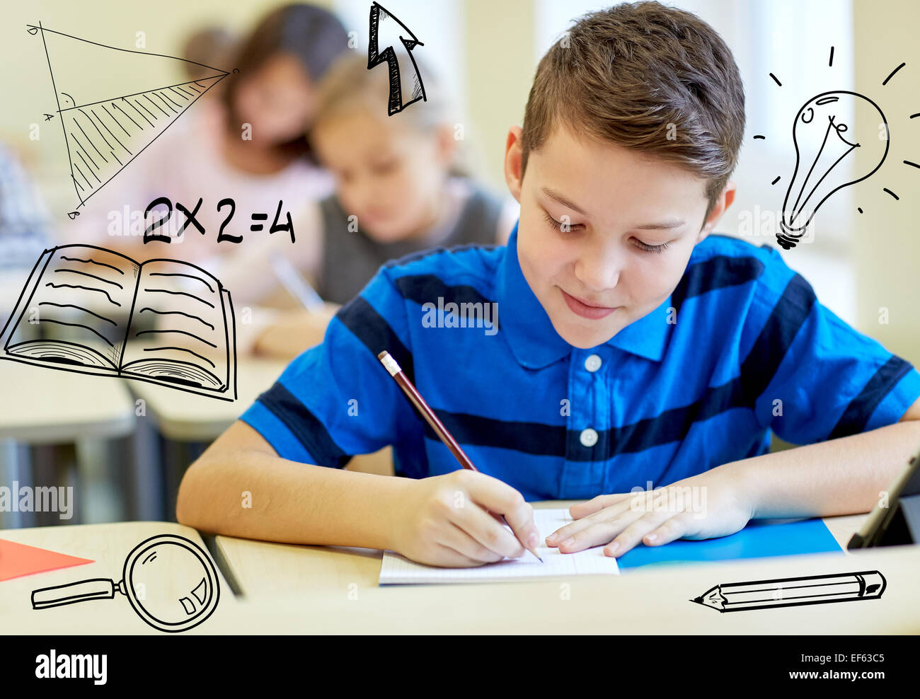 group of school kids writing test in classroom Stock Photo - Alamy