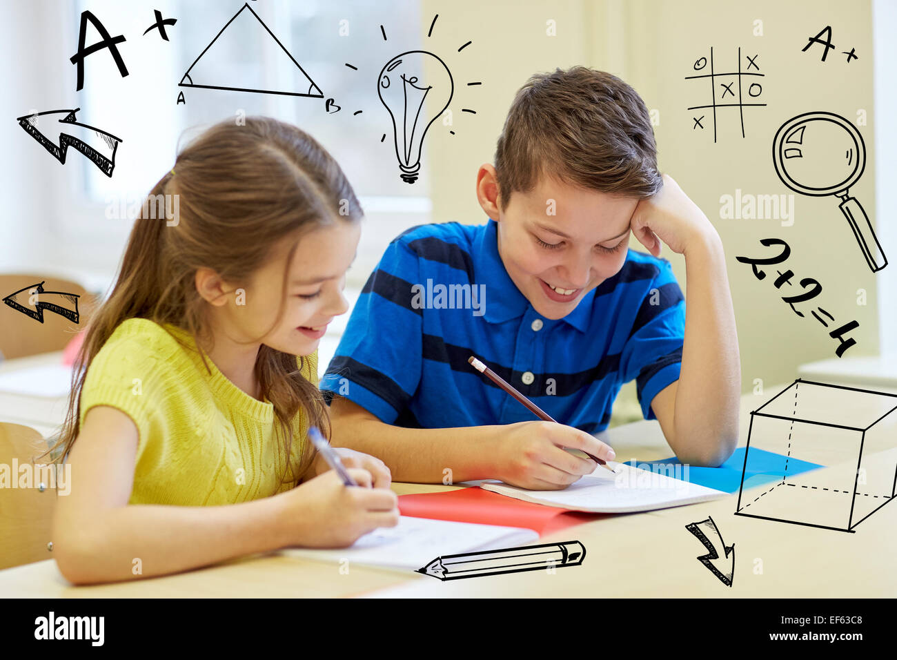group of school kids writing test in classroom Stock Photo - Alamy