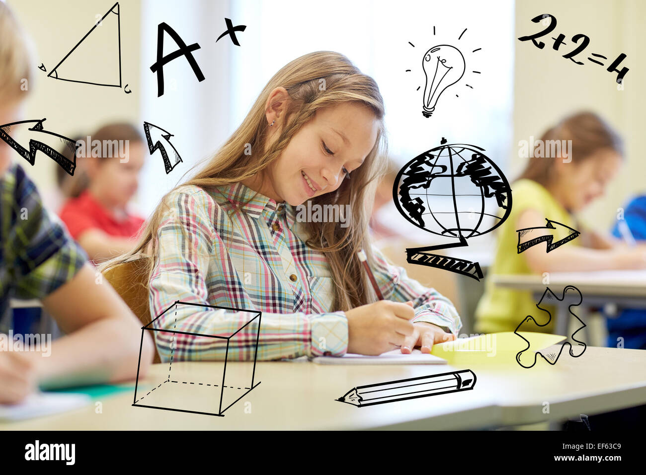 group of school kids writing test in classroom Stock Photo - Alamy